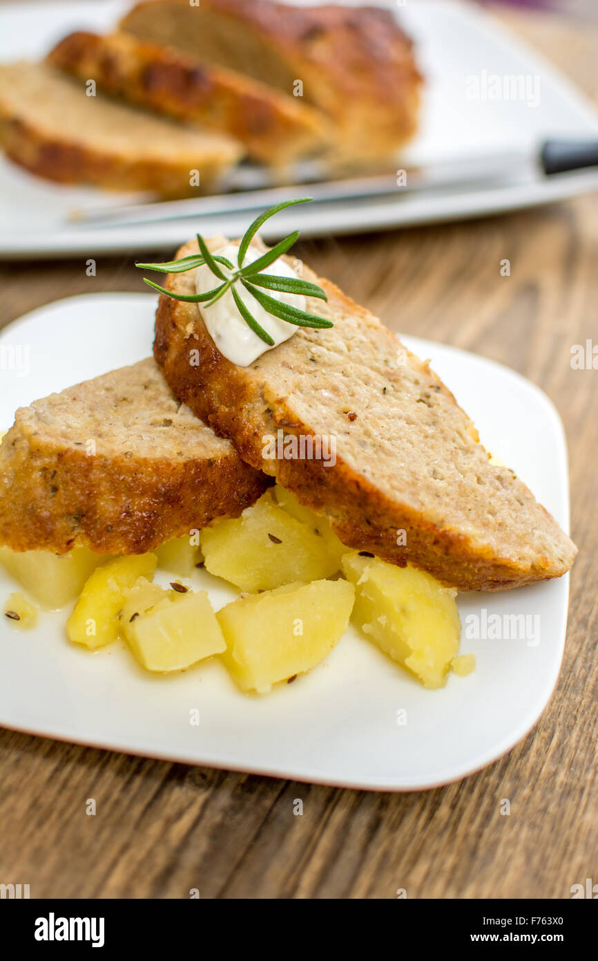 Traditional meat loaf on white plate photography Stock Photo - Alamy