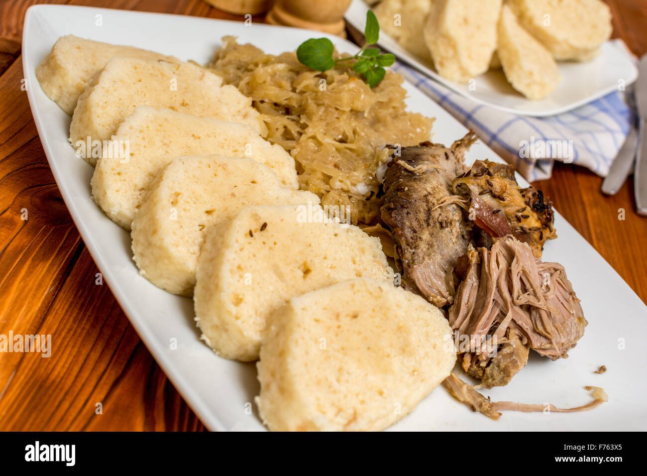 Czech traditional cuisine dumpling, cabbage and pork meat Stock Photo ...