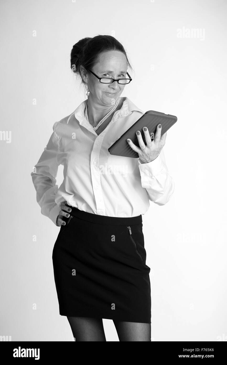 Mid forties business woman using her tablet computer Stock Photo - Alamy Mid forties business woman using her tablet computer Stock Photo - Alamy