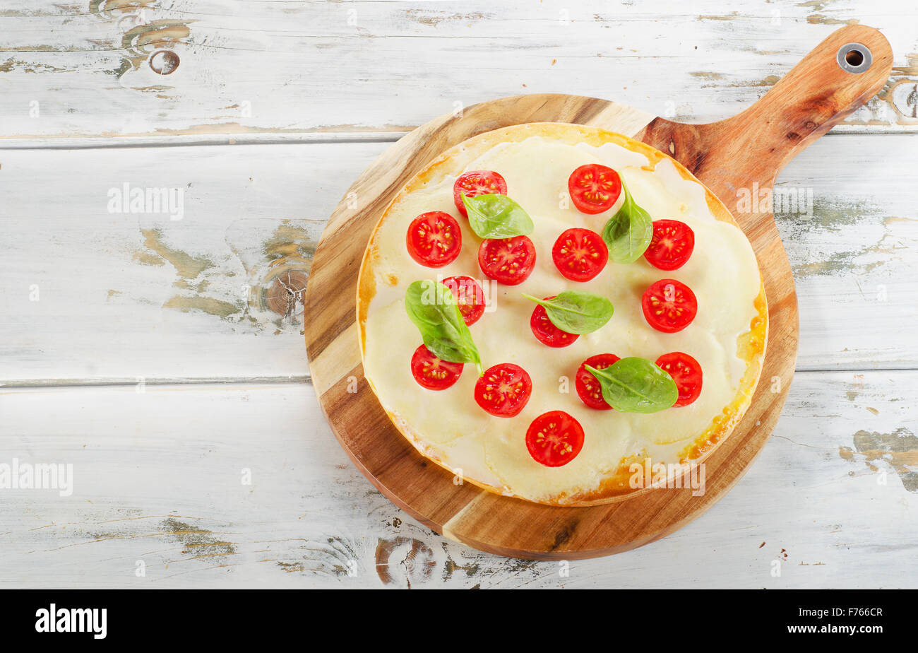 Italian Pizza on a wooden table. Top view Stock Photo - Alamy