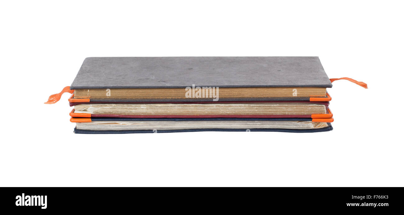 Stack of diaries isolated on a white background Stock Photo - Alamy
