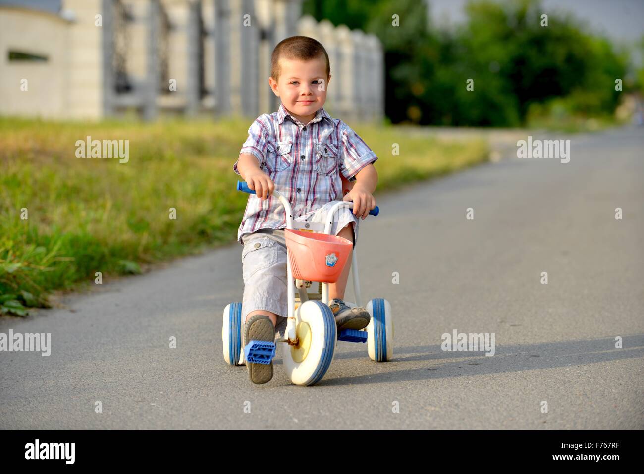 little boy enjoys riding a bike Stock Photo - Alamy
