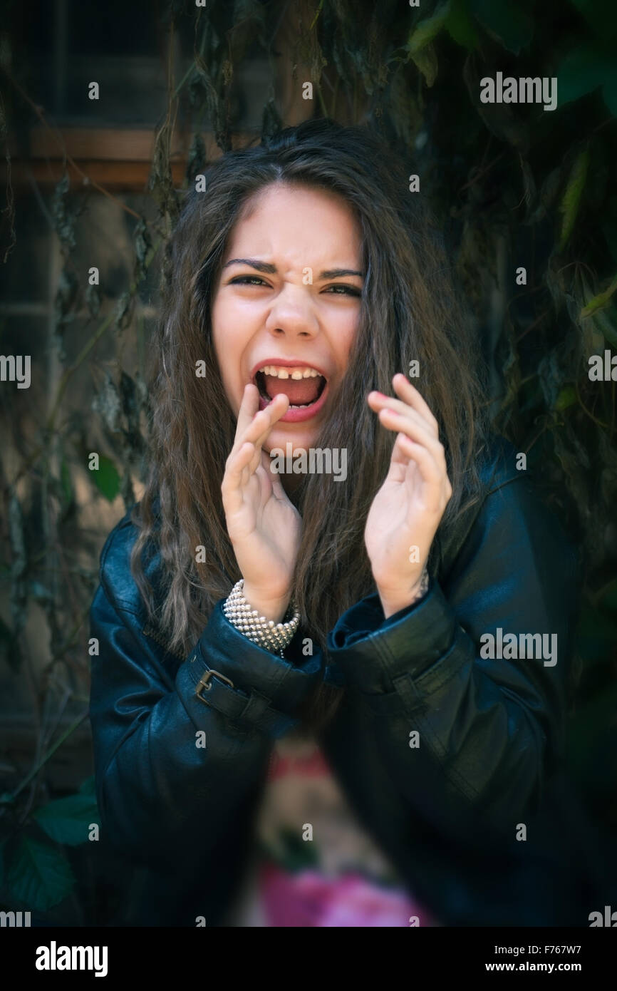 Young woman screaming Stock Photo - Alamy