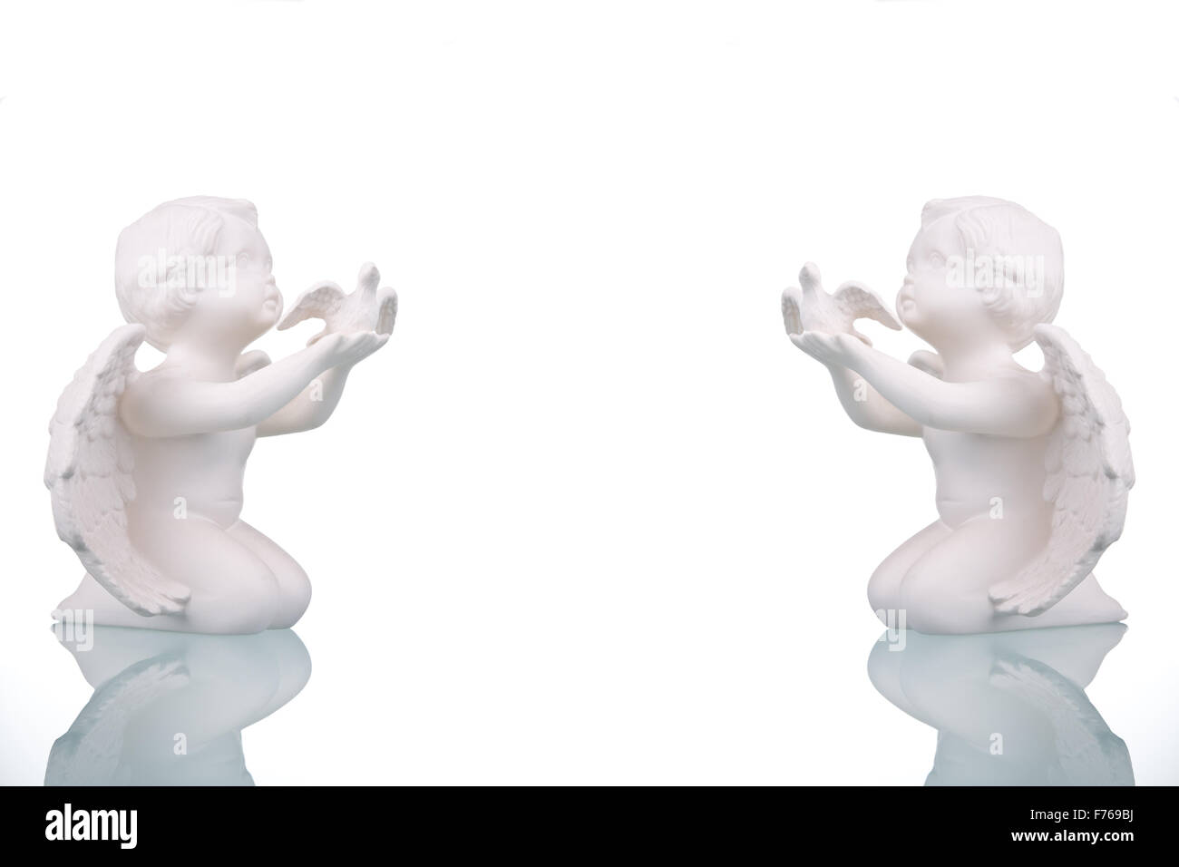 Two angels sit hi-res stock photography and images - Alamy