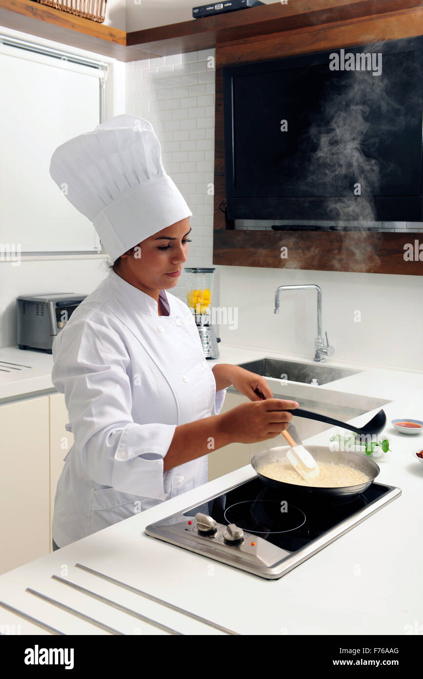 Woman chef adding wine hi-res stock photography and images - Alamy