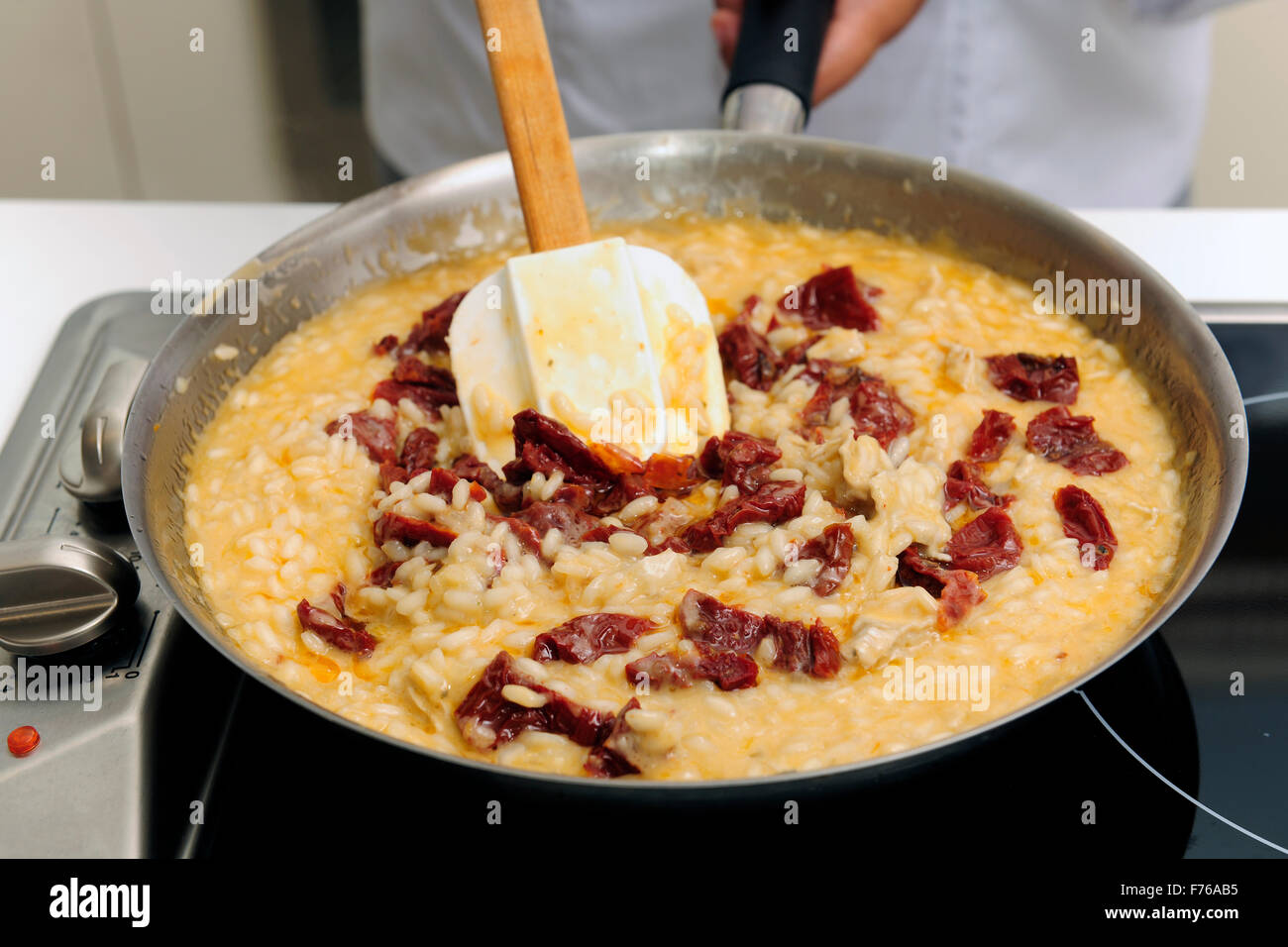 Stirring risotto hi-res stock photography and images - Alamy