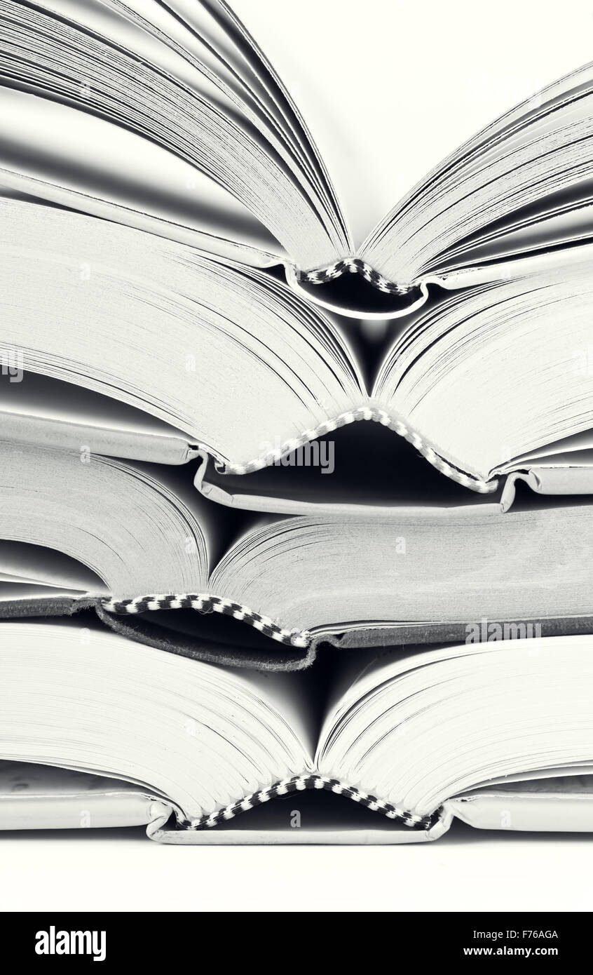 Four open book Stock Photo - Alamy