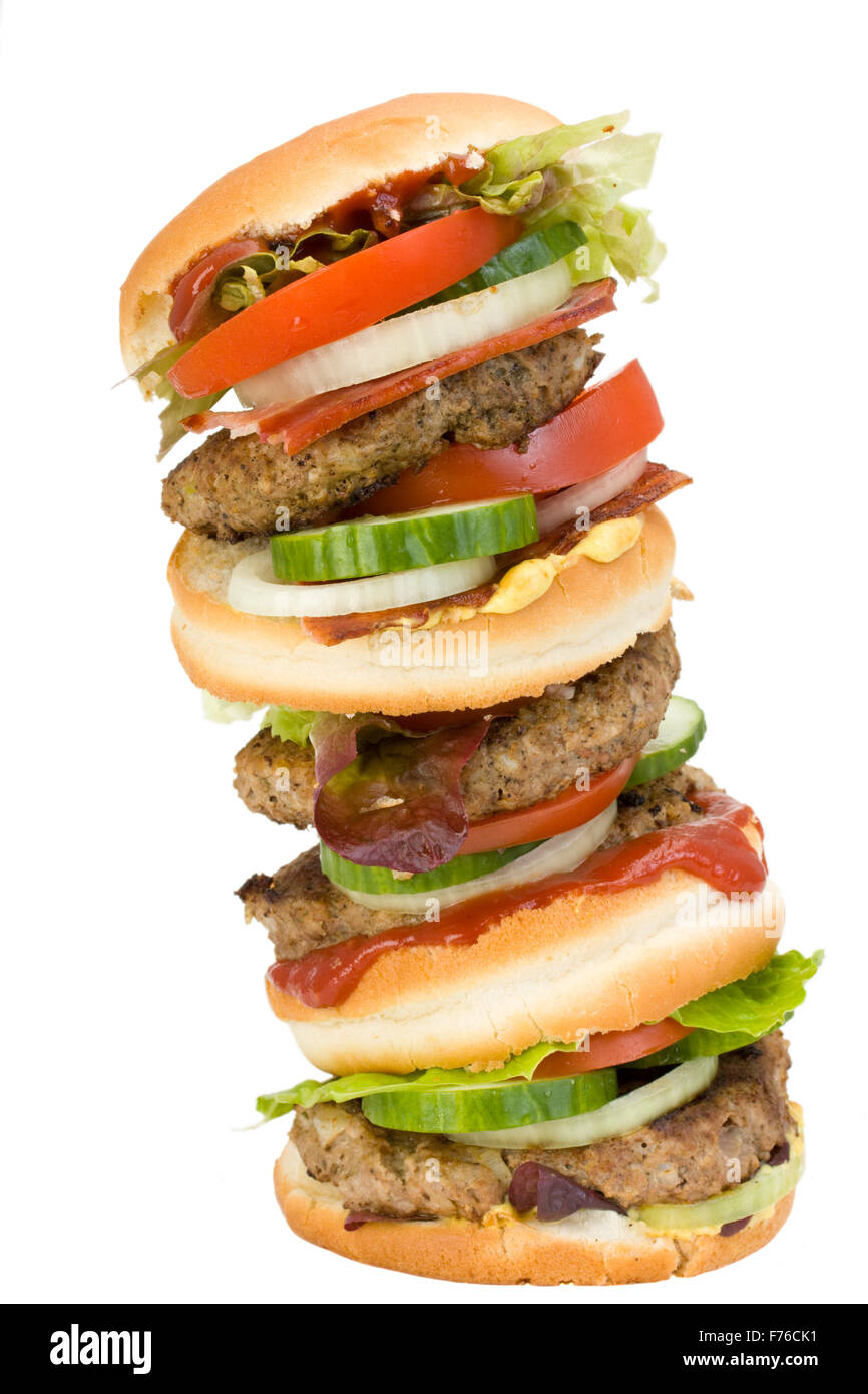 a home made quadruple hamburger isolated on white background Stock ...