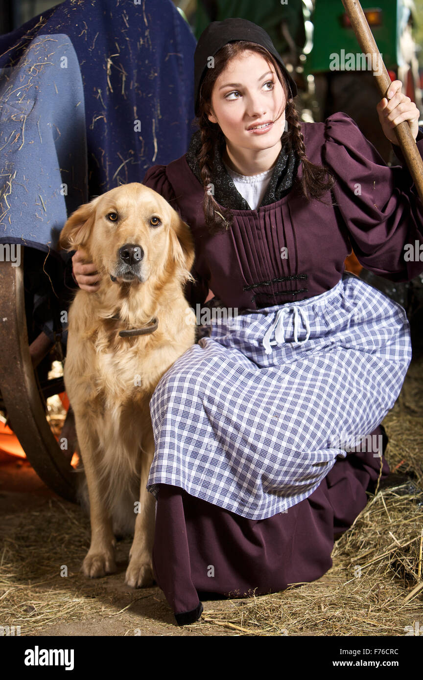 Farming girl and her dog Stock Photo - Alamy