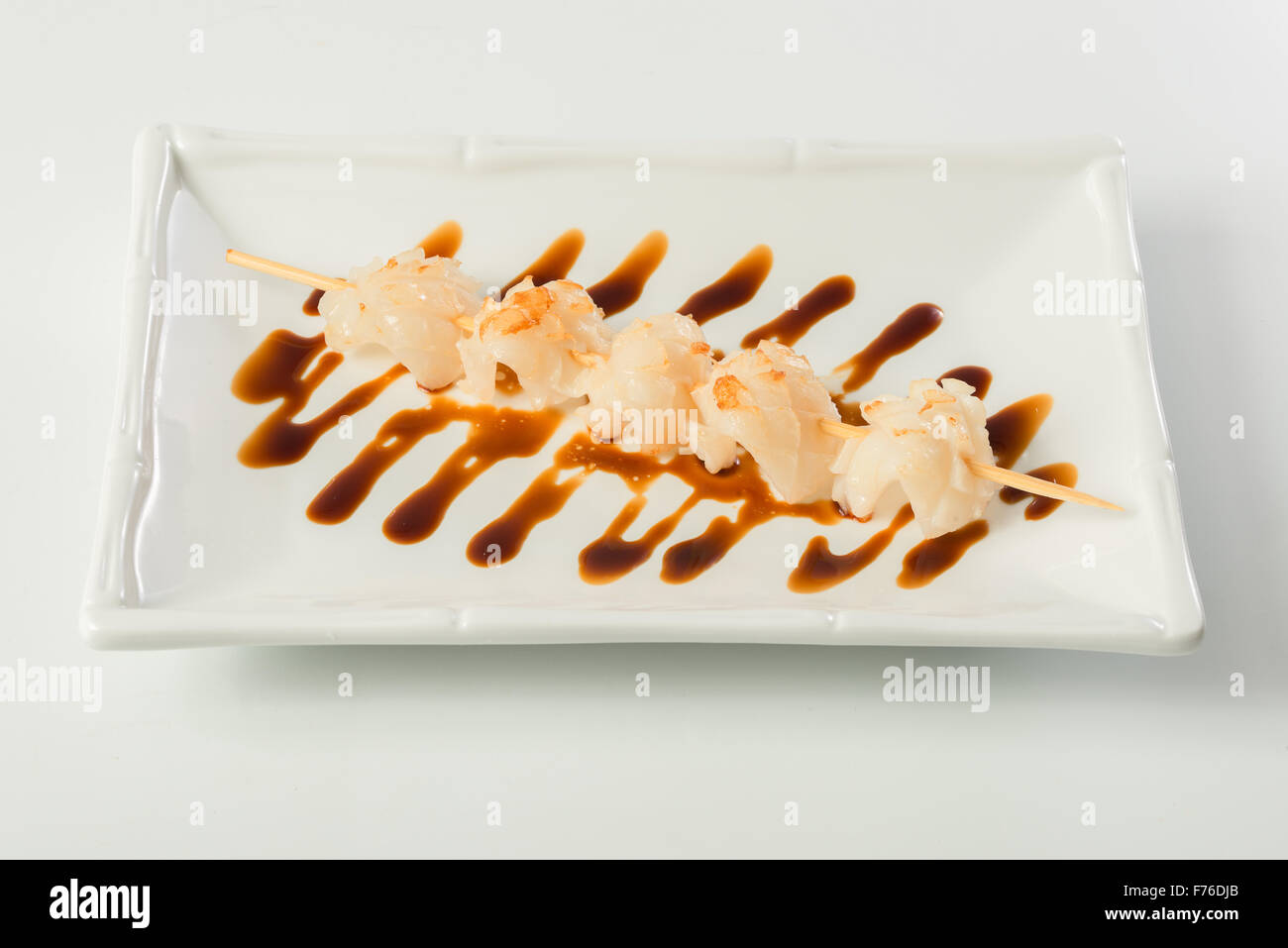 Fish slice on a stick Stock Photo - Alamy