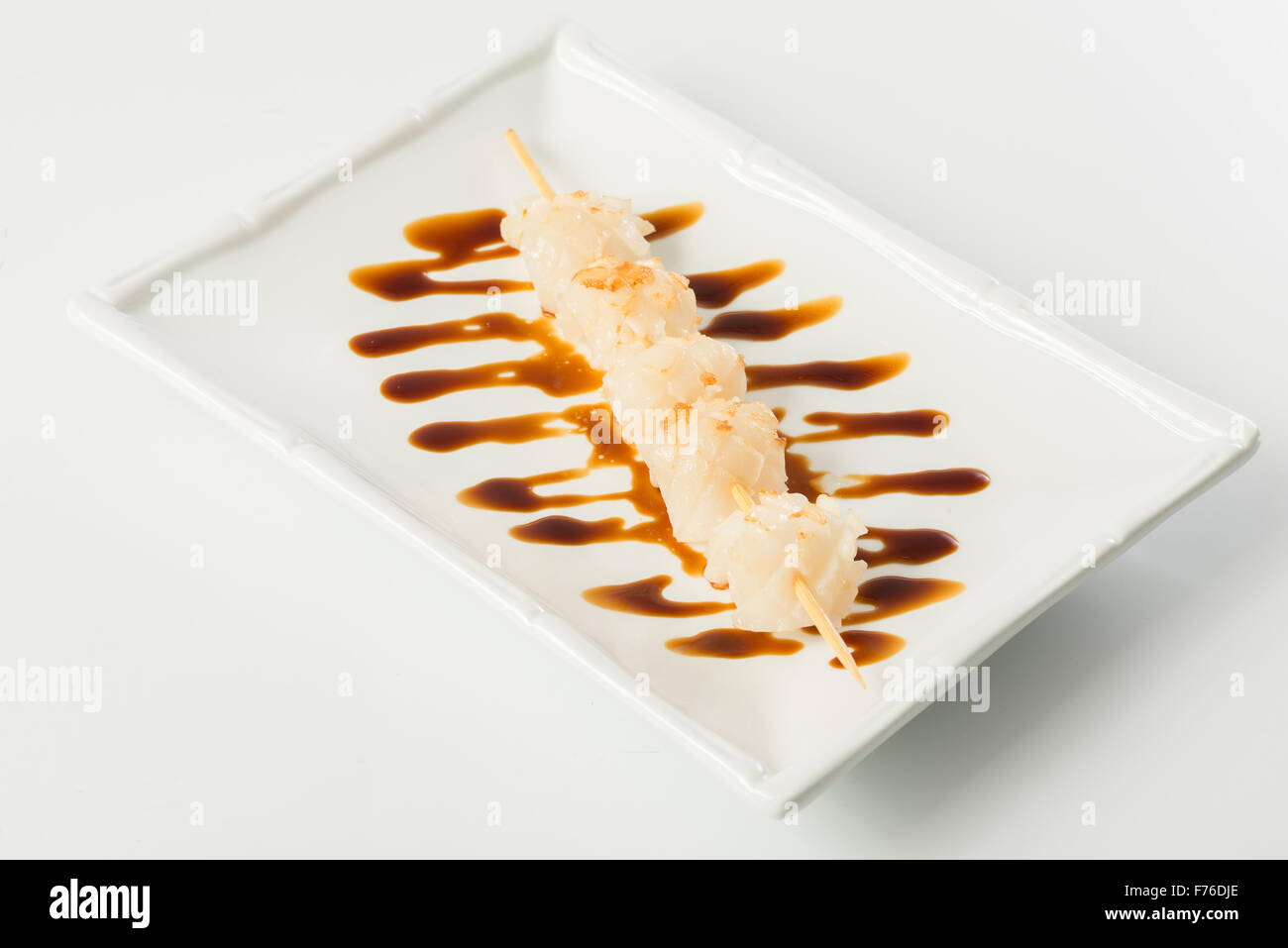 Fish slice on a stick Stock Photo - Alamy