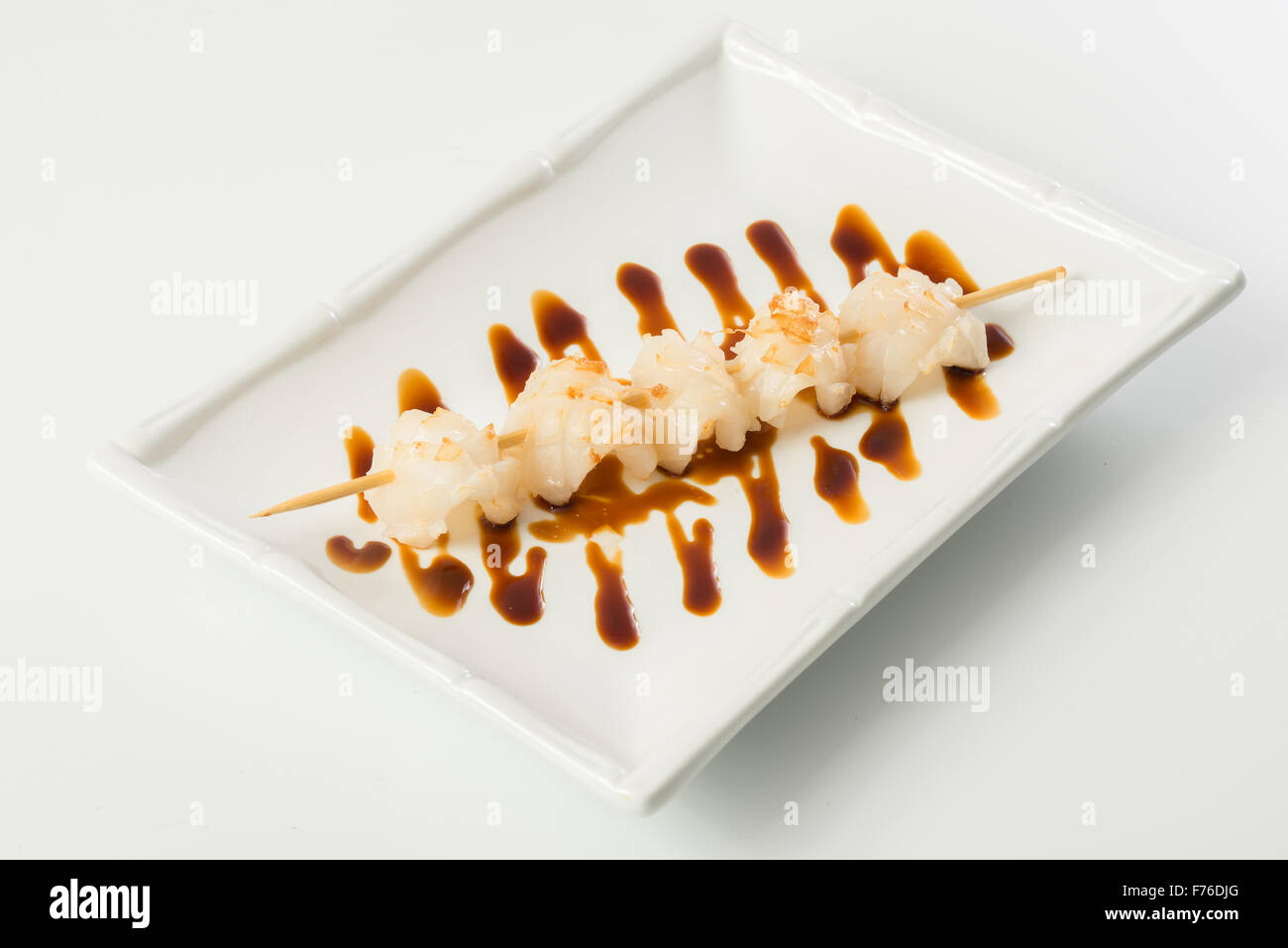 Fish slice on a stick Stock Photo - Alamy