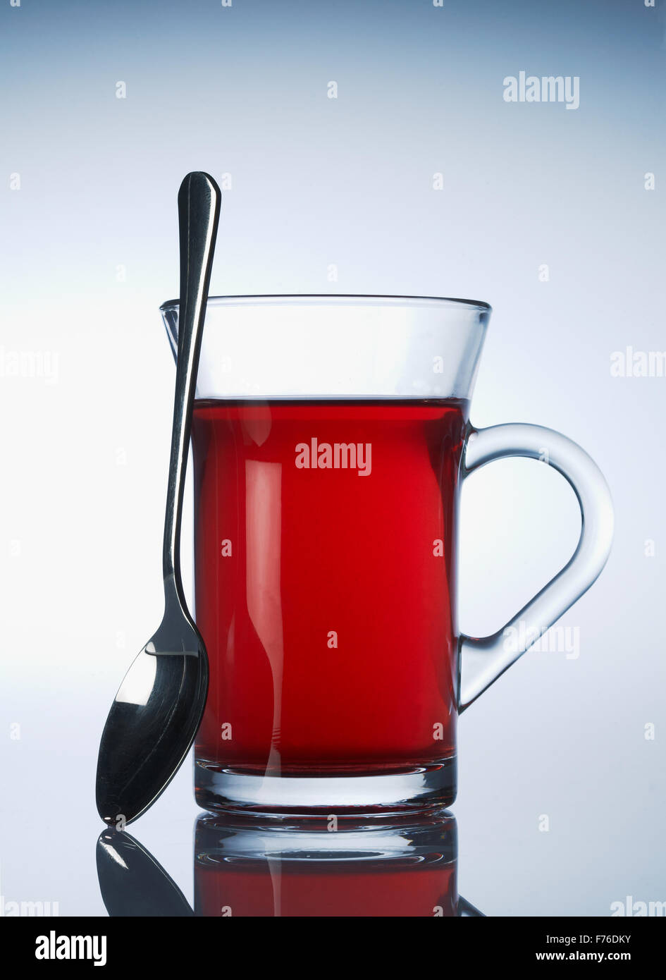 Cup of red fruit tea Stock Photo - Alamy