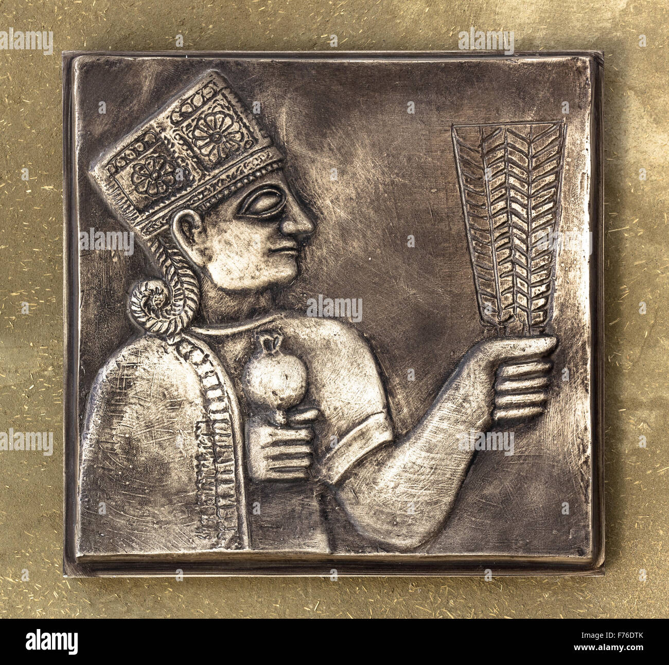 An ancient Mayan relief on bronze tablet with golden tones Stock Photo ...