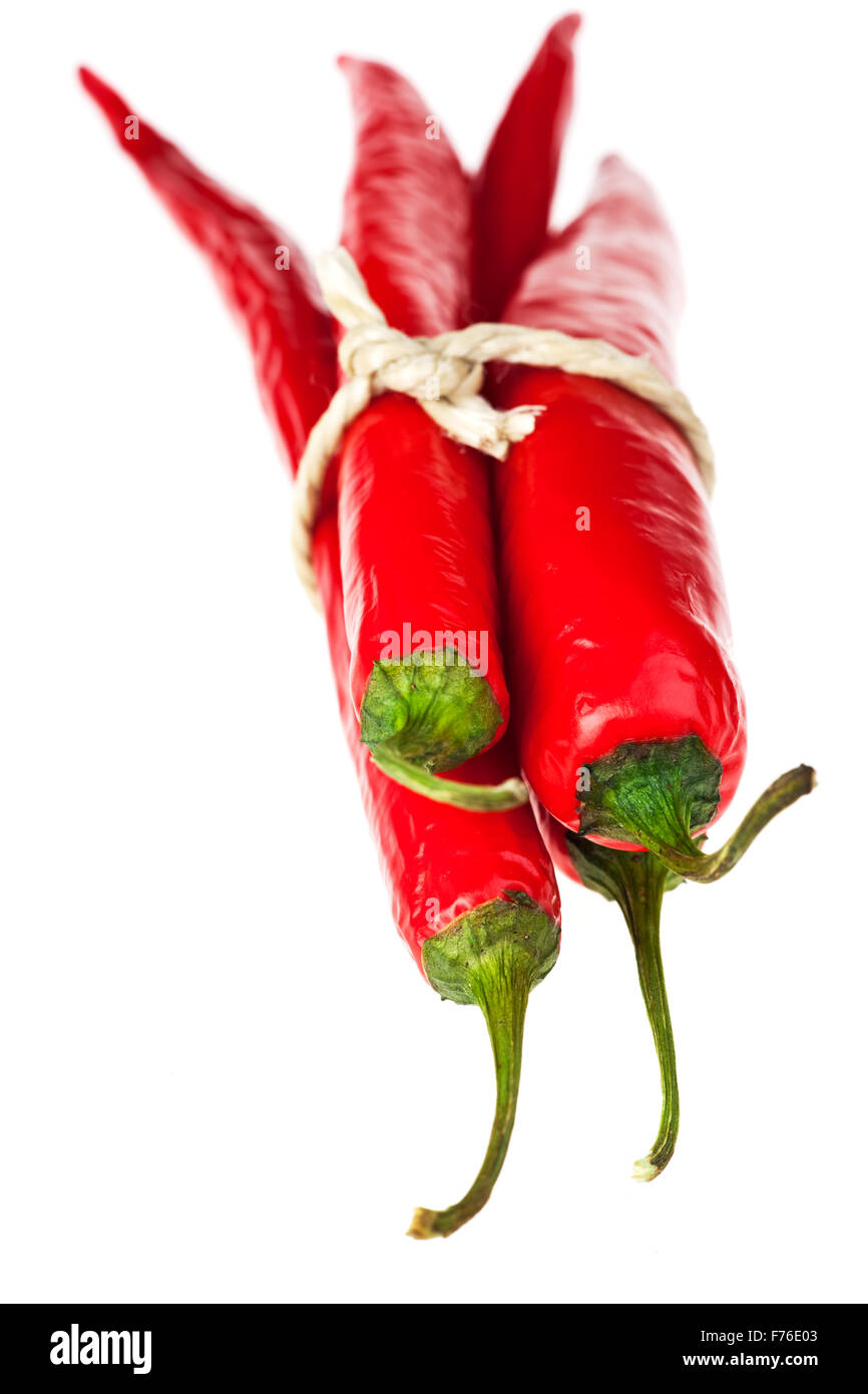 bunch of red hot chili peppers on white background Stock Photo - Alamy