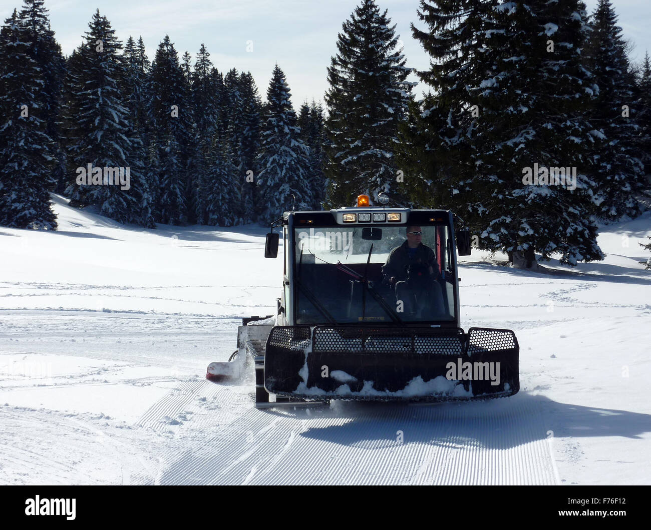 Snowcat driven on the snow Stock Photo - Alamy