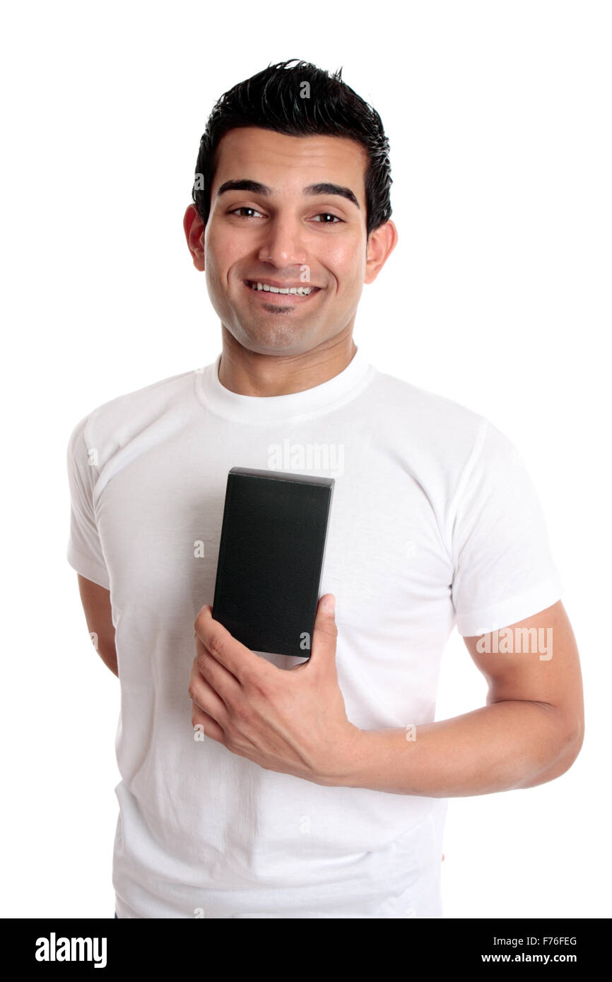 Smiling man holding retail product Stock Photo - Alamy