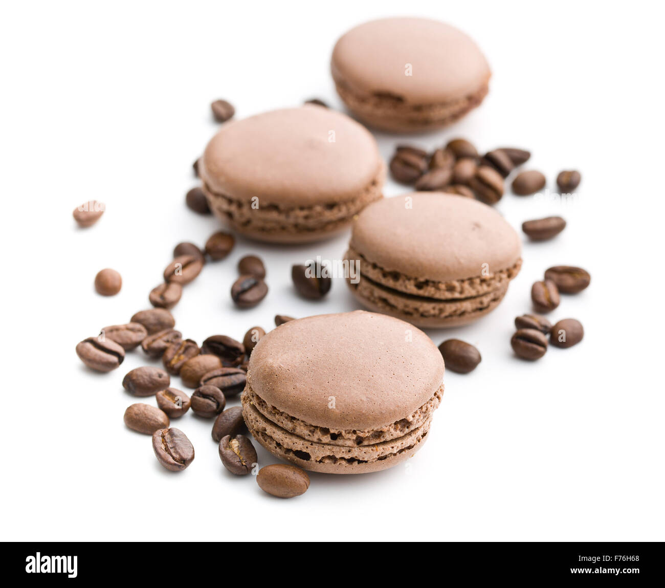 macarons with coffee flavor and coffee beans on white background Stock ...