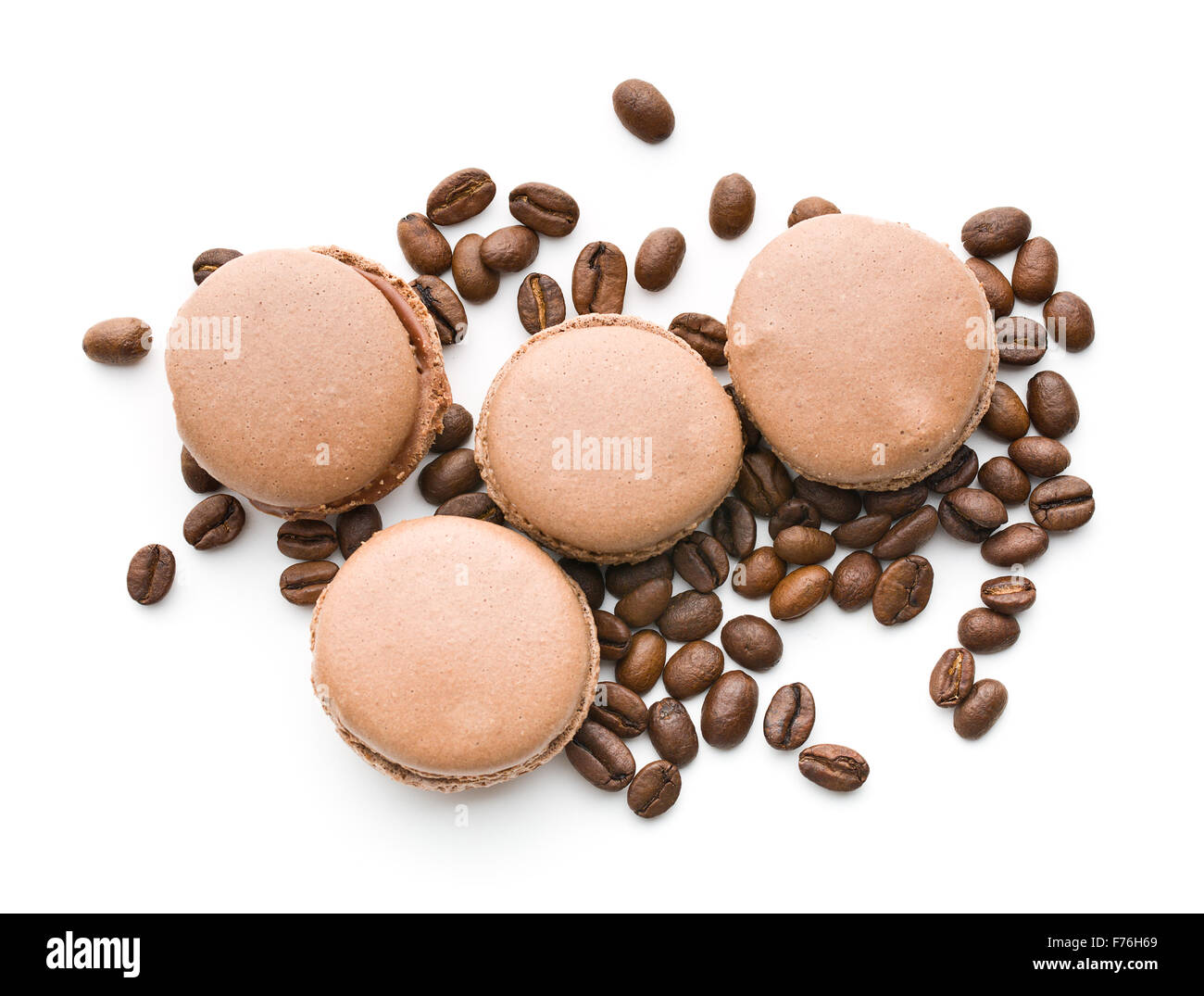 macarons with coffee flavor and coffee beans on white background Stock ...