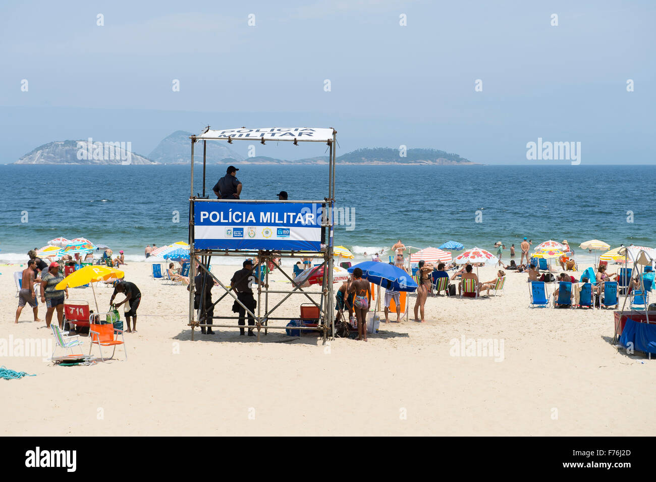 RIO DE JANEIRO, BRAZIL - NOVEMBER 10, 2015: Police take cover in the ...