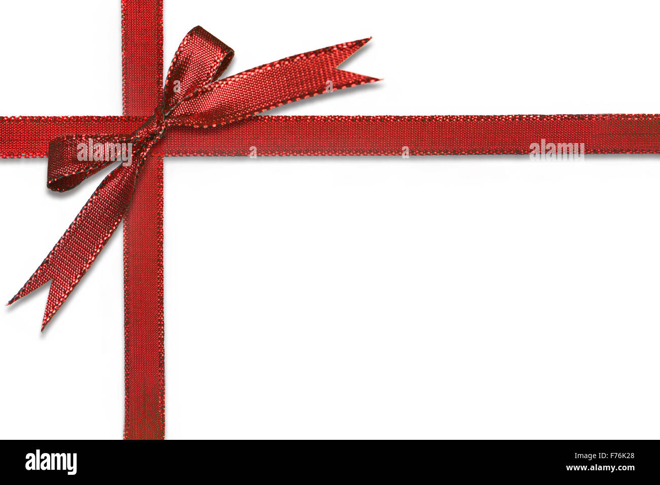 Christmas Gift Wrapped in Pretty Red Bow Stock Photo - Alamy