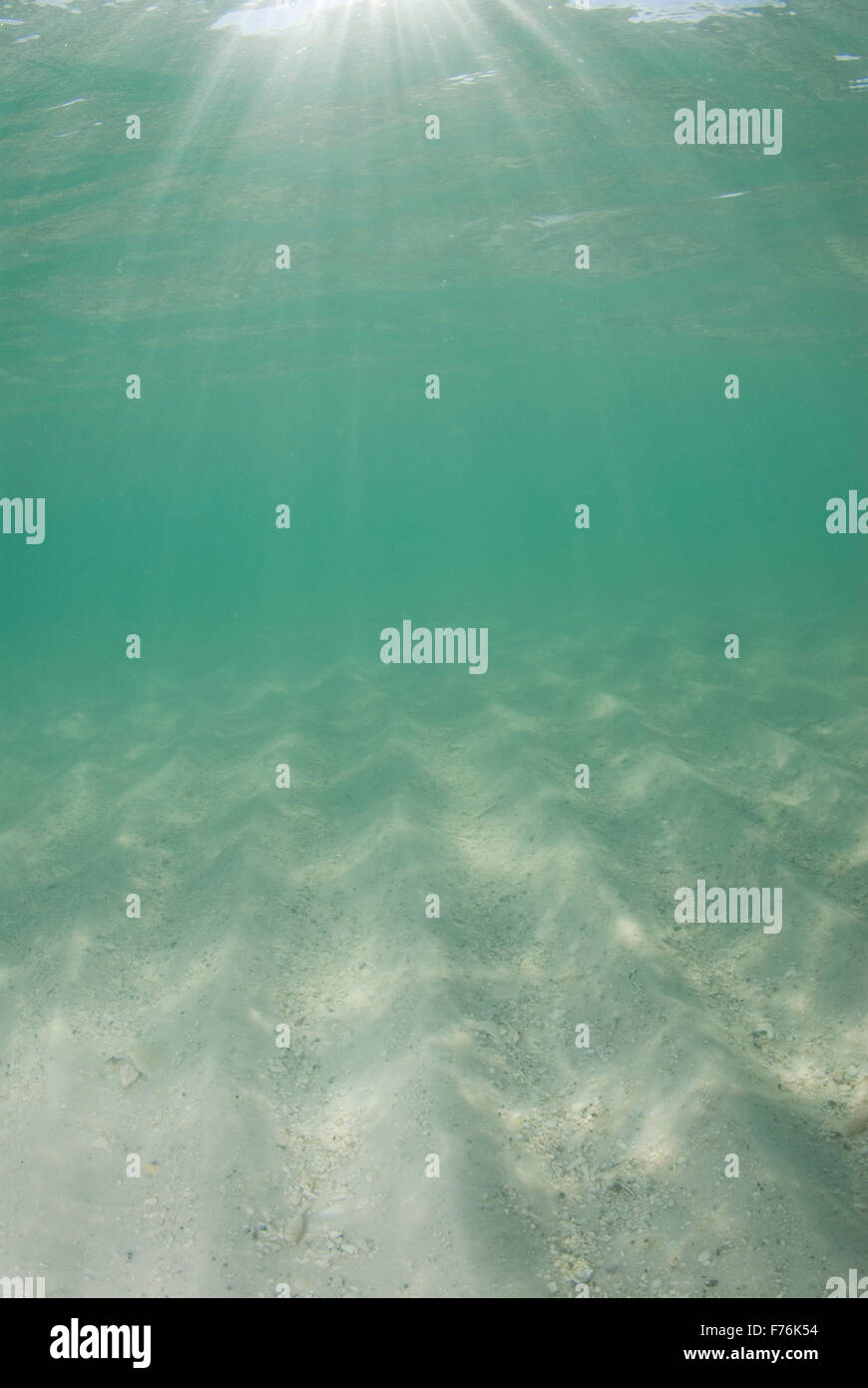 Underwater Beach Sunrays half sand Stock Photo - Alamy