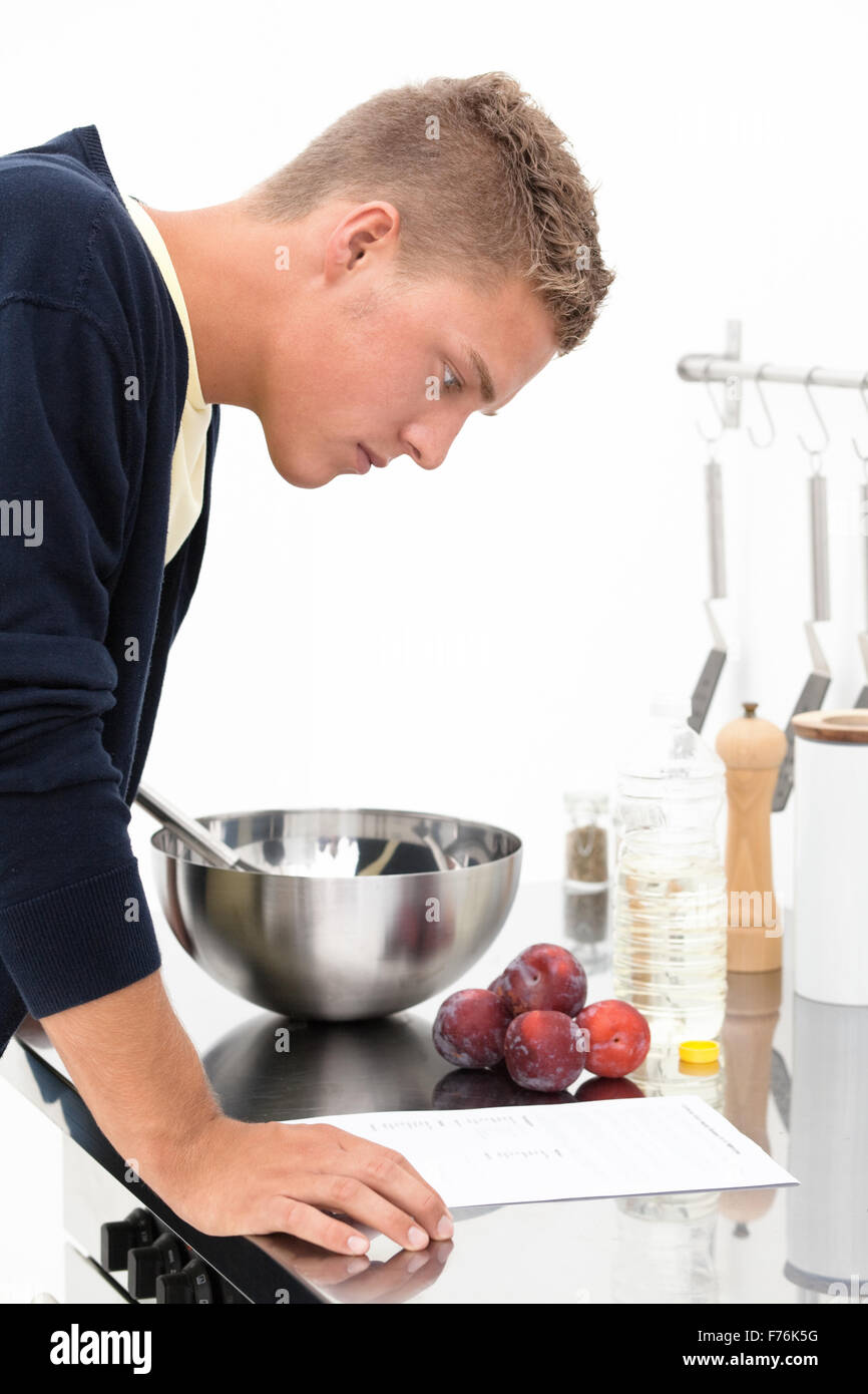 Cook with recipe Stock Photo - Alamy
