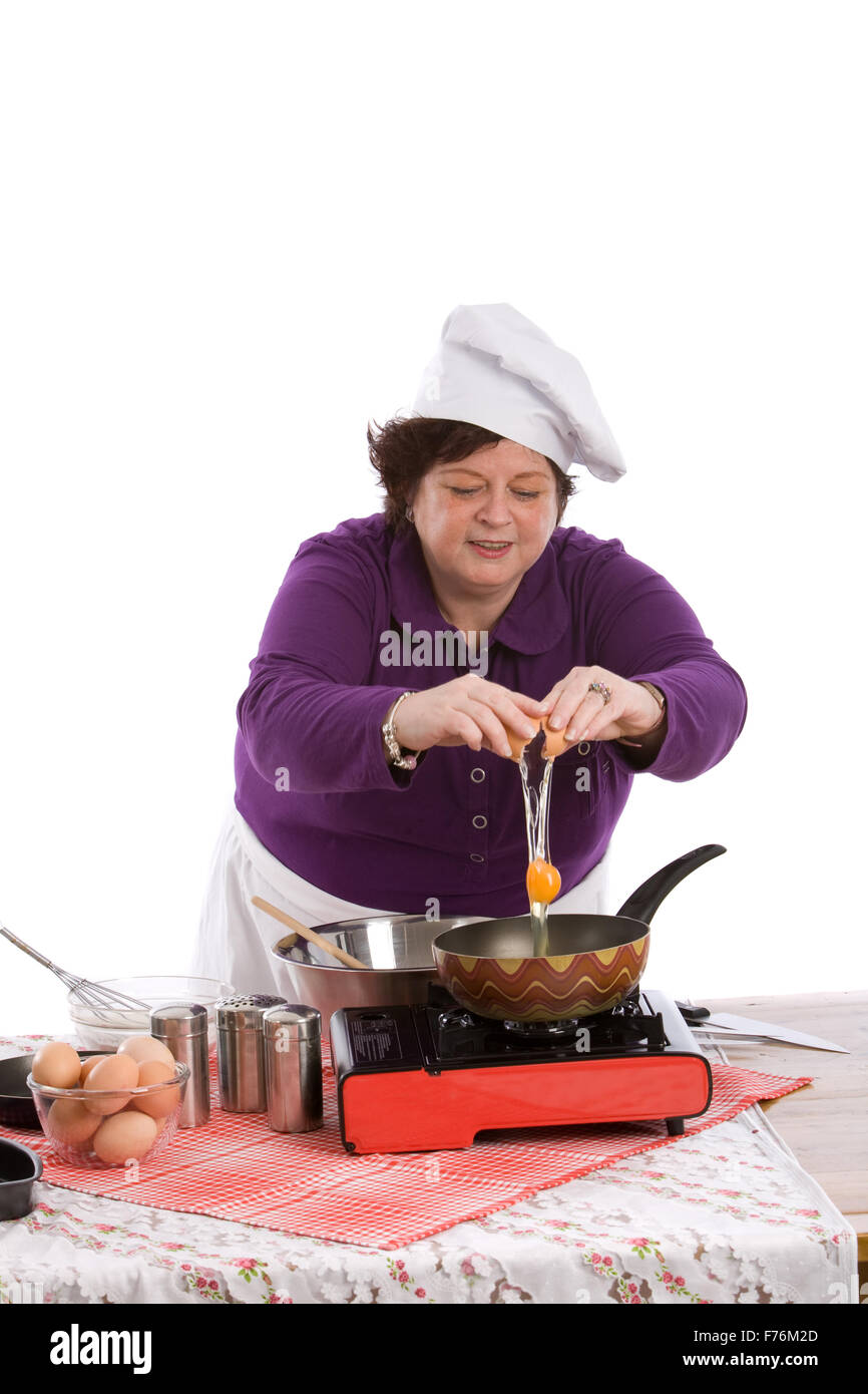 Adding an egg Stock Photo - Alamy