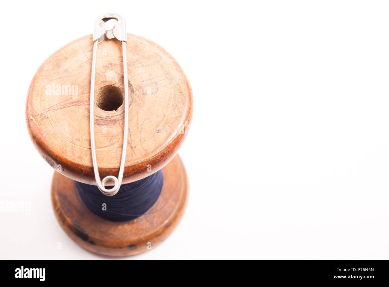 spool of thread with needle Stock Photo - Alamy