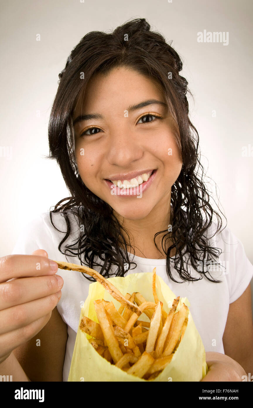 Girl with fries Stock Photo - Alamy