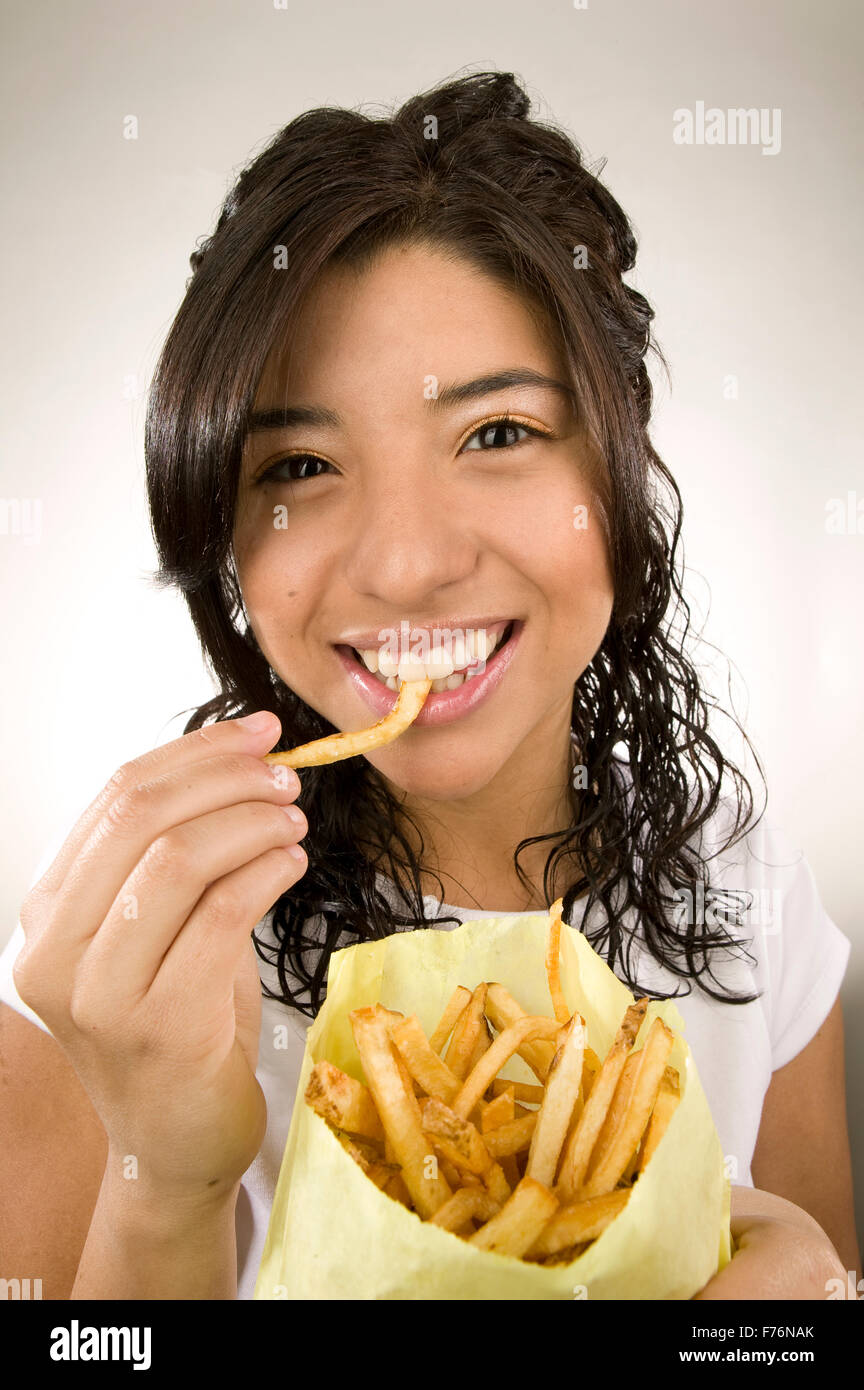 Girl with fries Stock Photo - Alamy