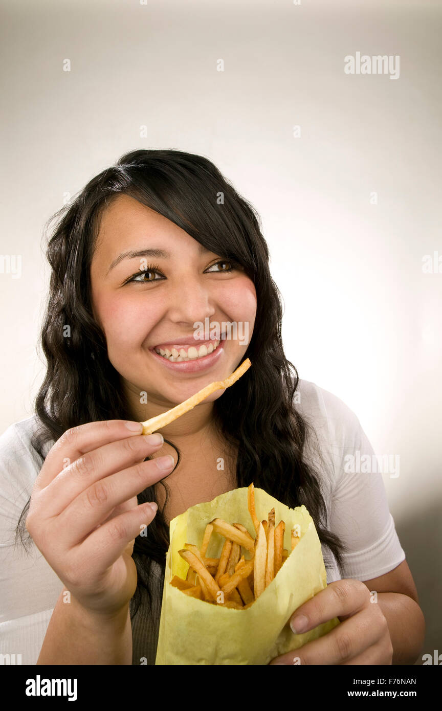 Girl with fries Stock Photo - Alamy