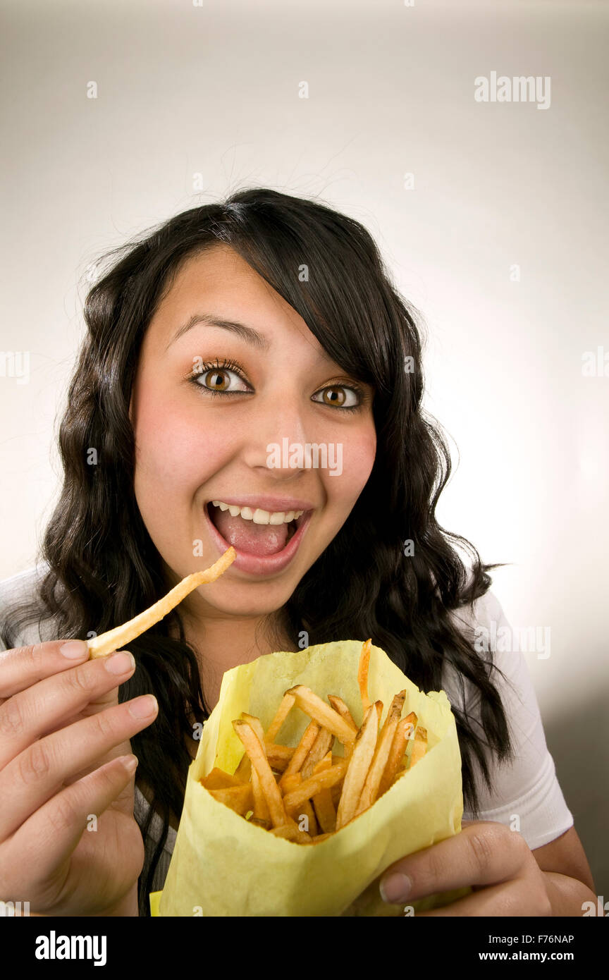 Girl with fries Stock Photo - Alamy