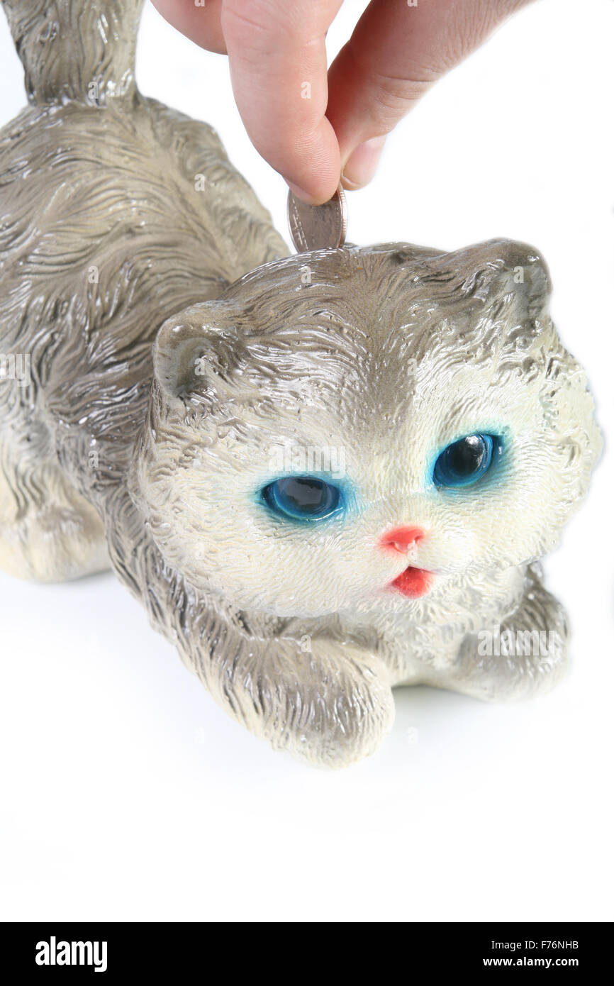 hand with coin and money-box Stock Photo - Alamy