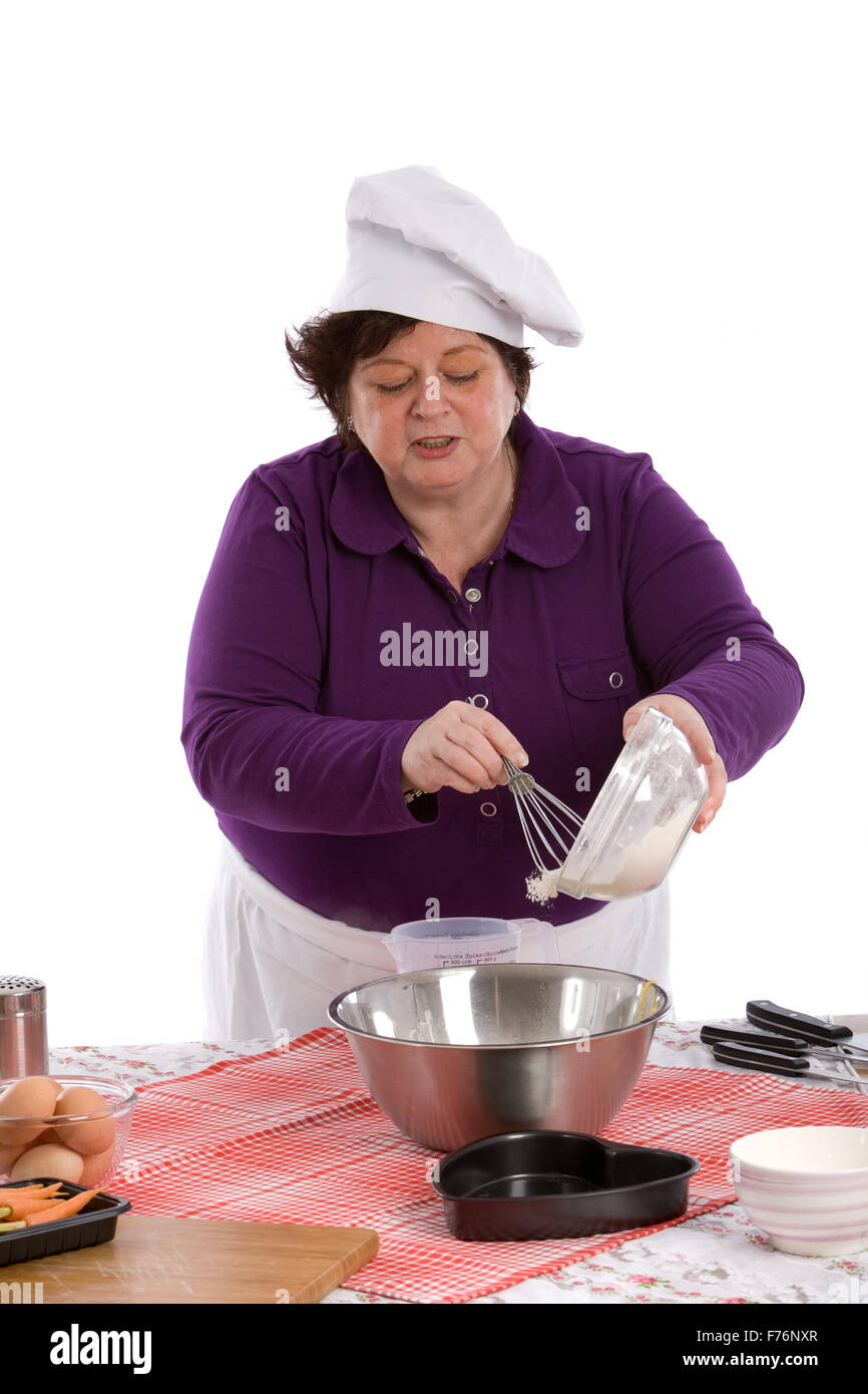 Adding some flour Stock Photo - Alamy