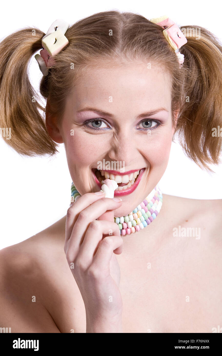 Biting the candy Stock Photo - Alamy