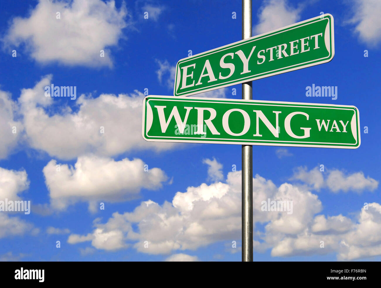Street Signs With Easy Street and Wrong Way Stock Photo - Alamy