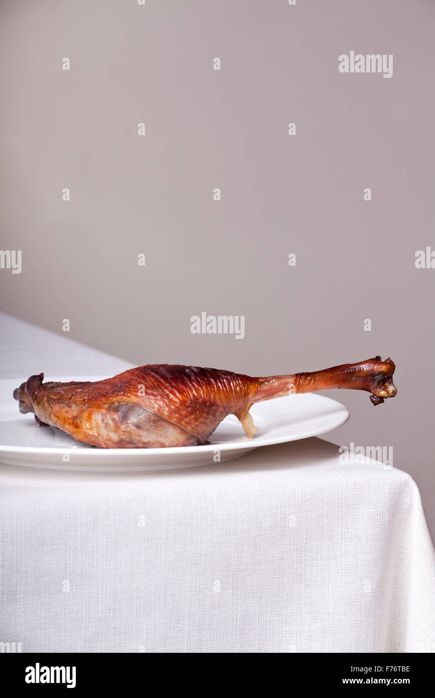 roasted goose leg on linen tablecloth Stock Photo - Alamy