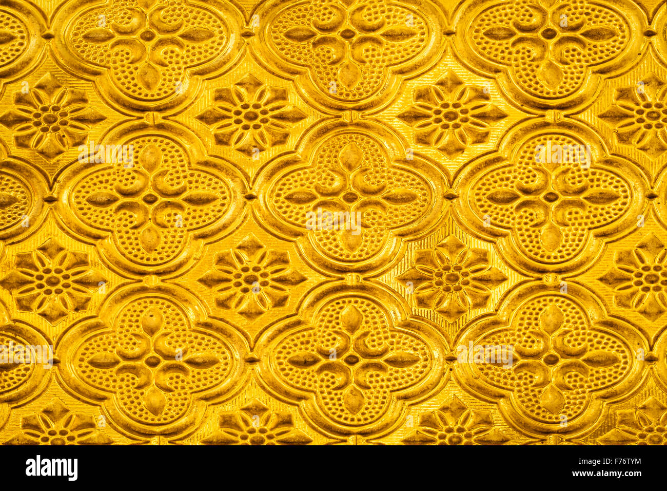 Yellow patterned window glass Stock Photo - Alamy