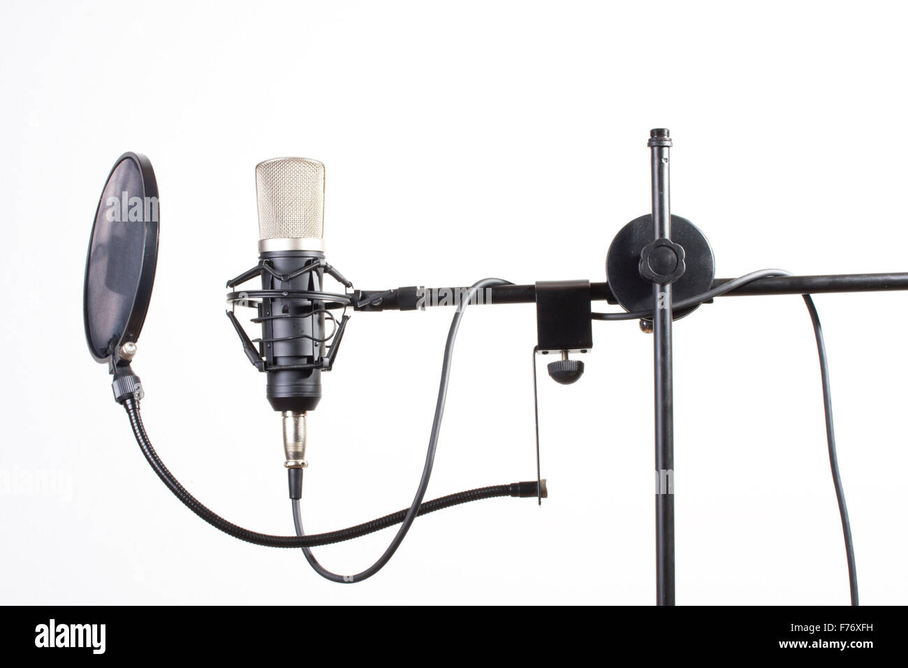 studio microphone on a stand on white background Stock Photo - Alamy