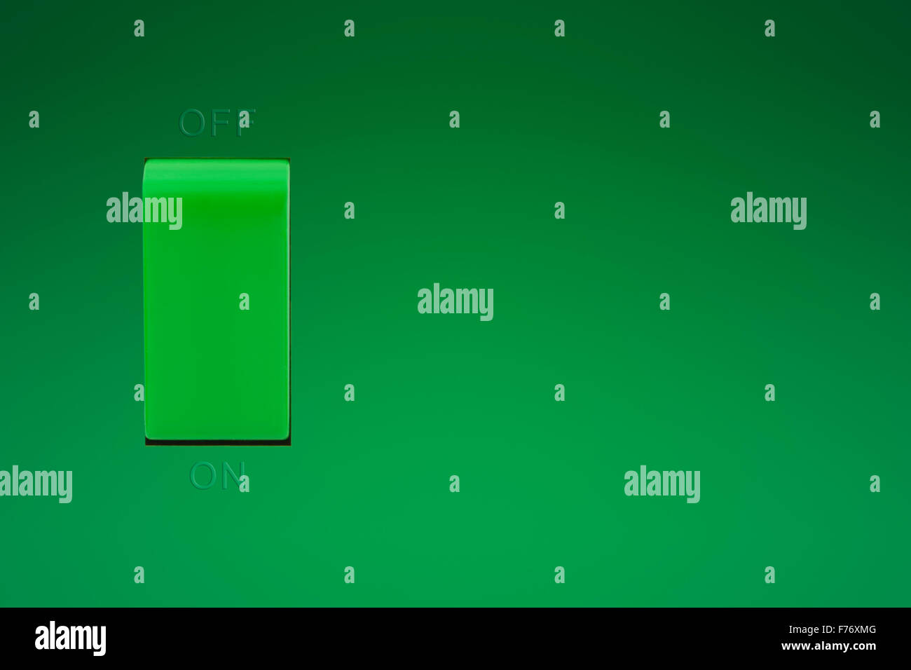Green Switch on a green background Stock Photo - Alamy