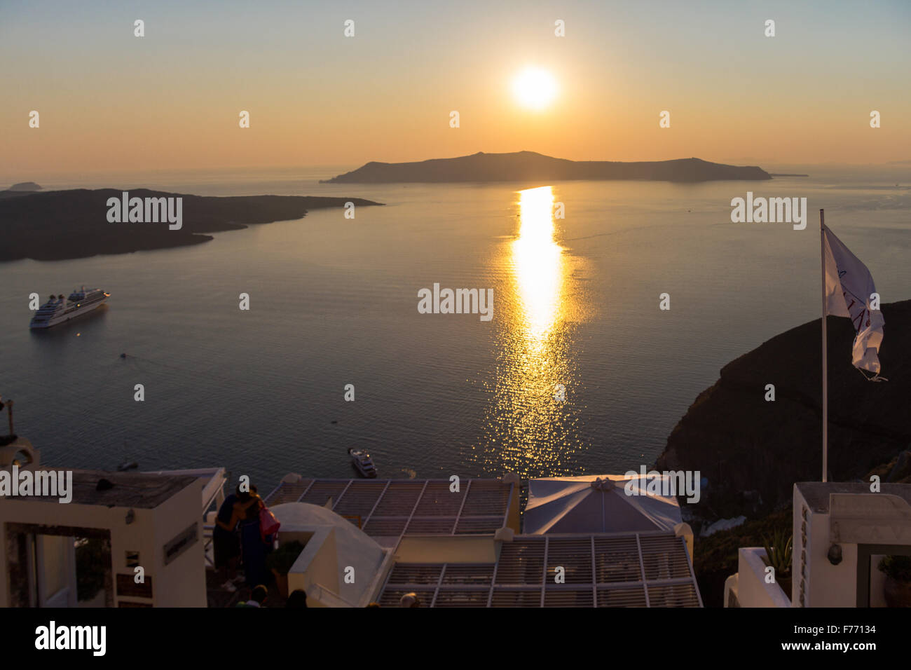 Sunset over water crater, Santorini Stock Photo - Alamy