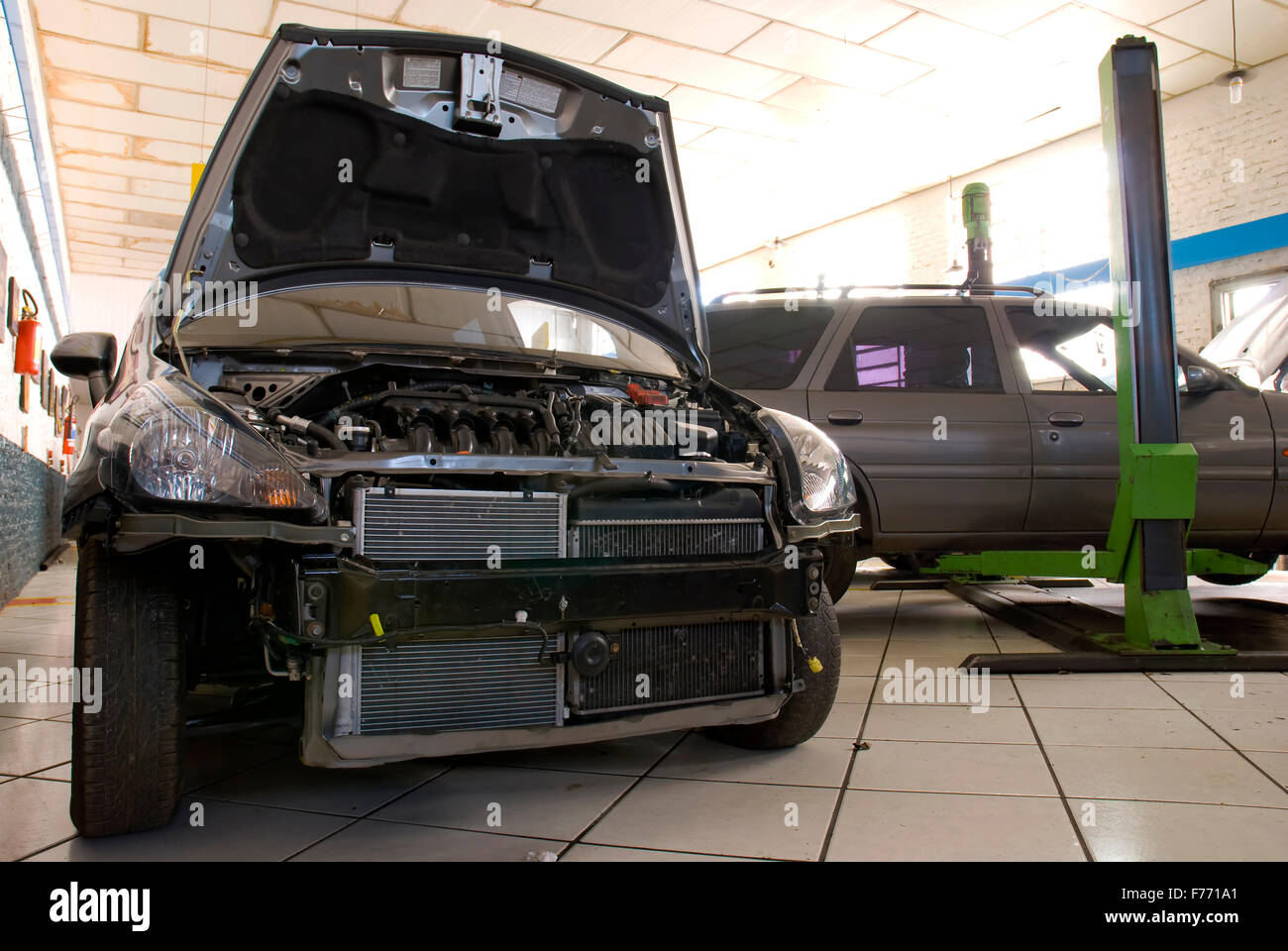 Modern Black Car in a Repair Shop Stock Photo - Alamy