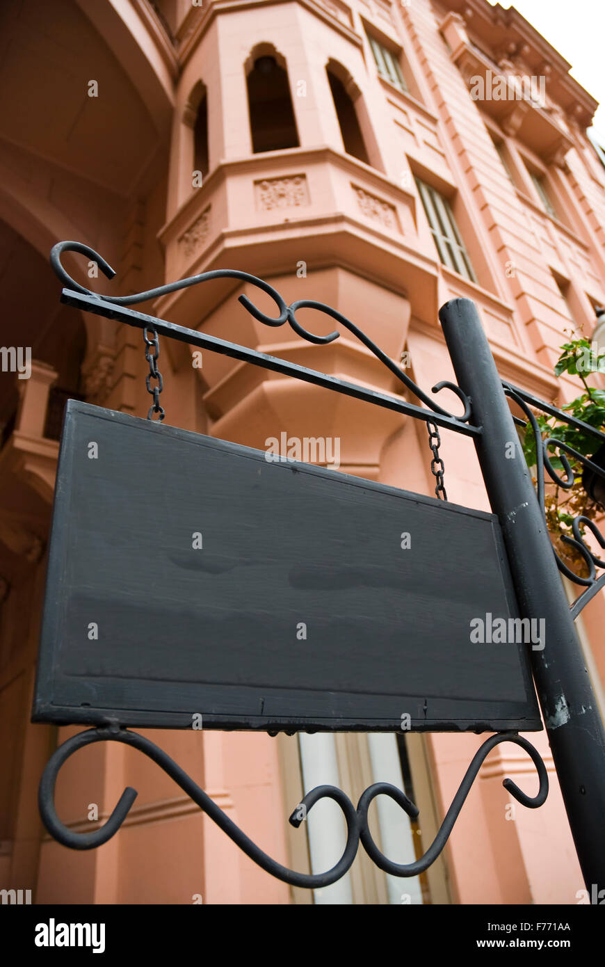 Pink Building Wooden Sign Stock Photo - Alamy