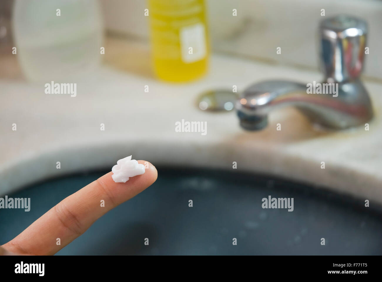 Finger with cream Stock Photo - Alamy