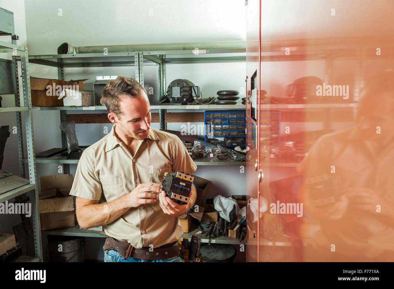 Elevator Repair Man at work Stock Photo - Alamy
