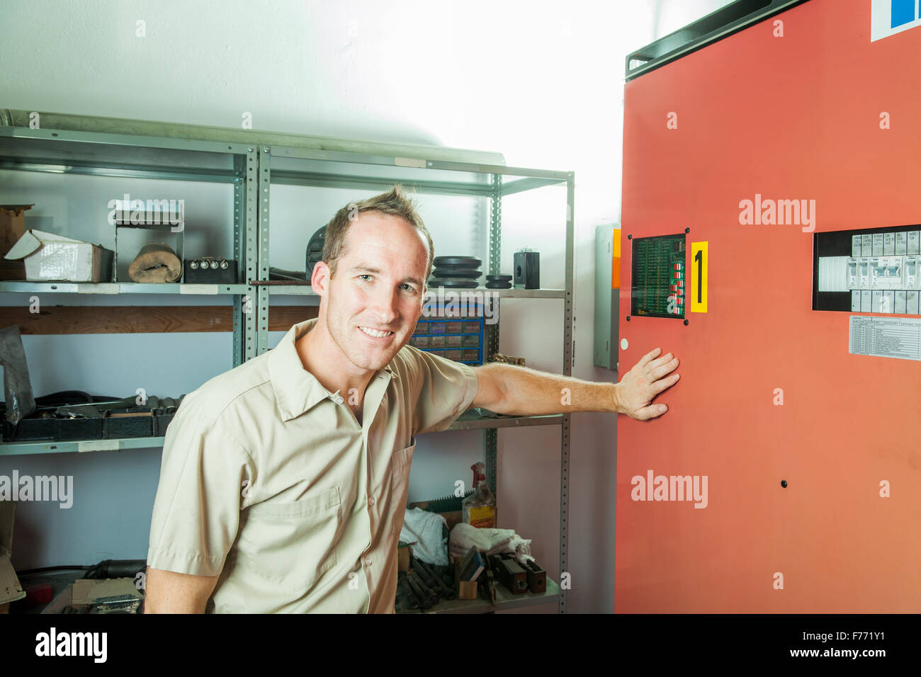 Elevator Repair Man at work Stock Photo - Alamy