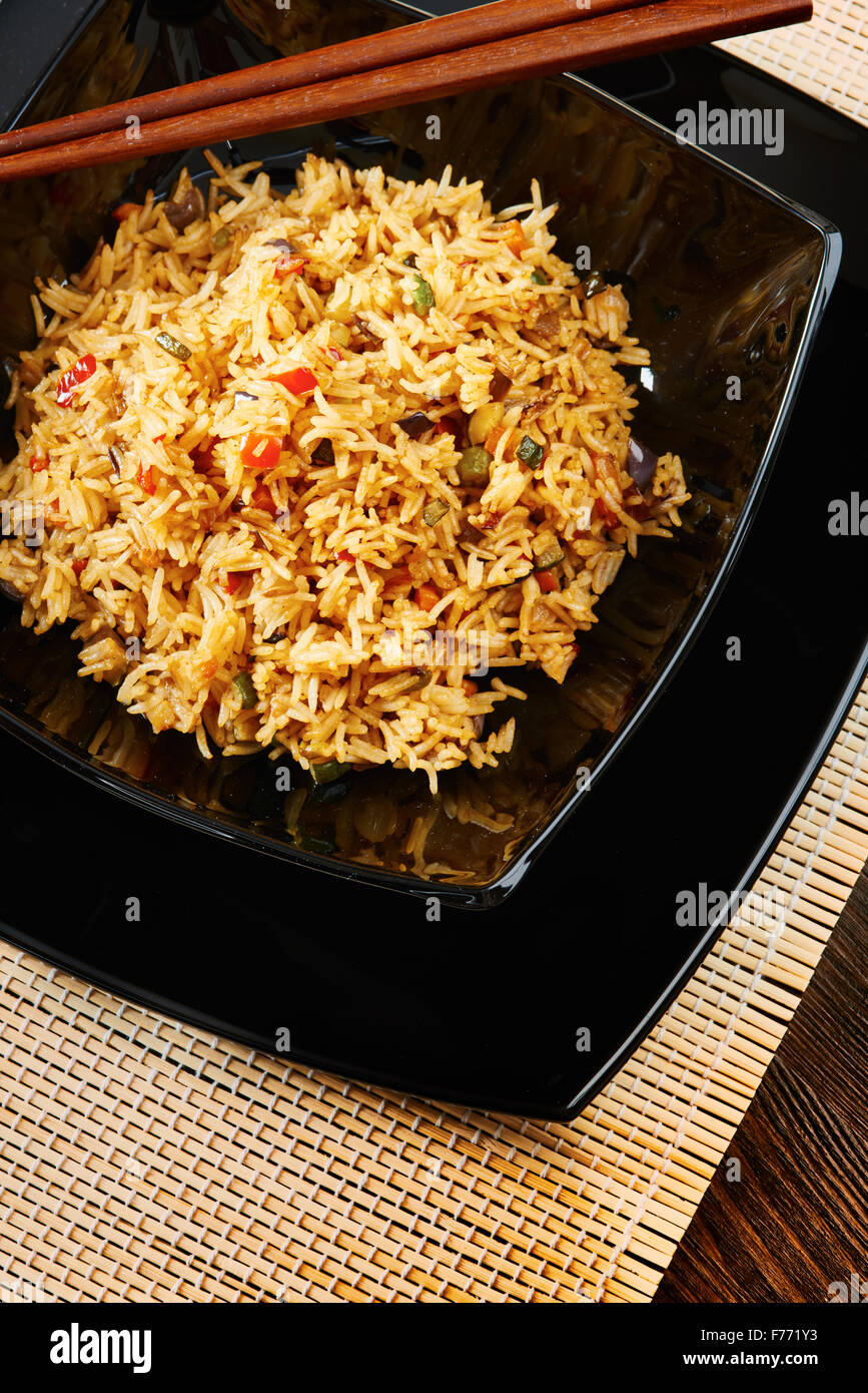 Basmati rice with vegetables on black square dish Stock Photo - Alamy