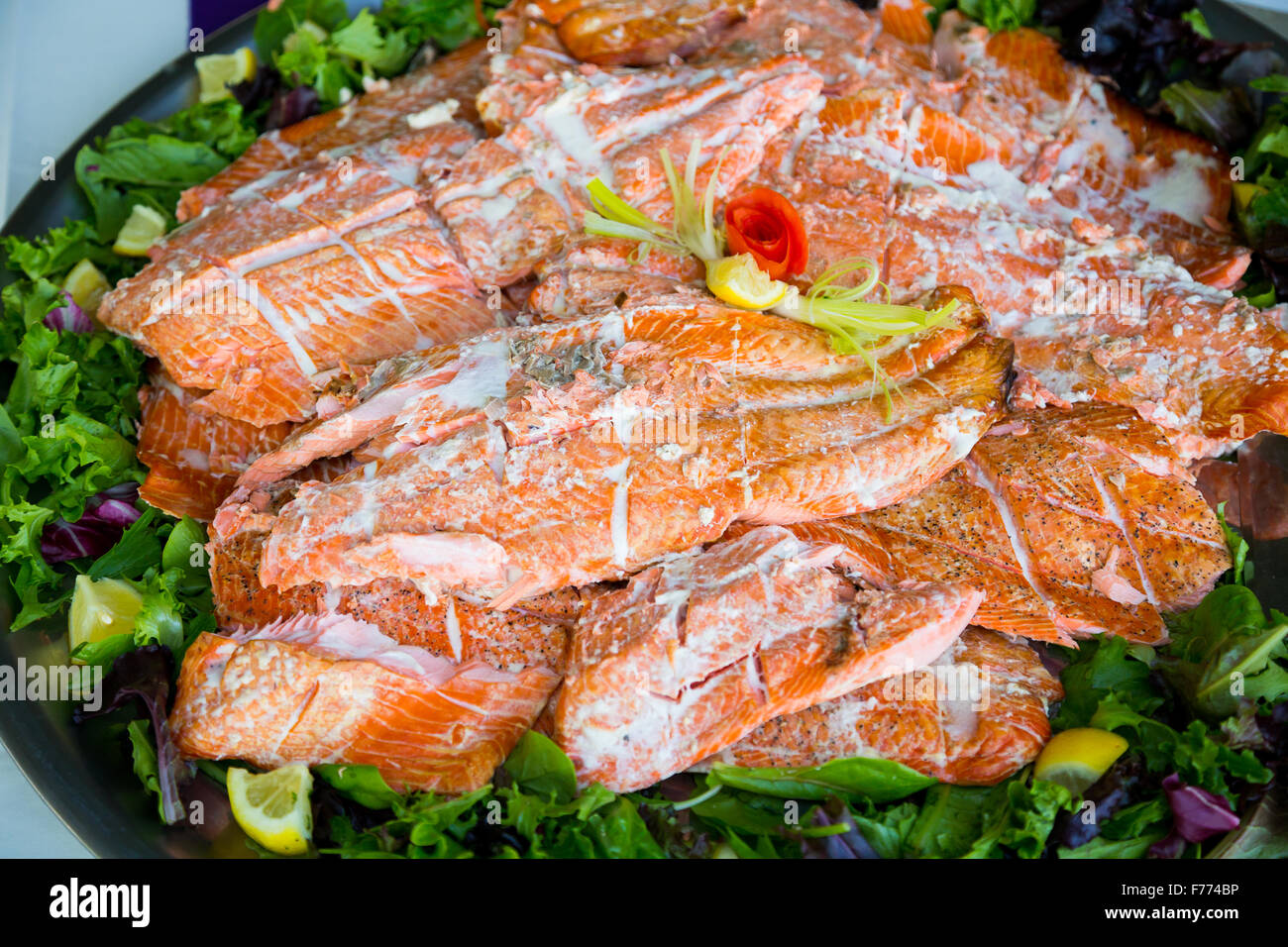 Organic wild caught salmon fillets on a bed of lettuce at a wedding ...
