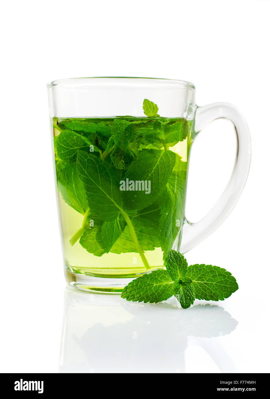 Mint tea in a glass cup isolated over white Stock Photo - Alamy